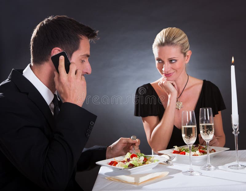Man Taking a Mobile Call during Dinner Stock Image - Image of ...
