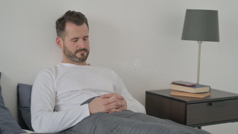 Man Taking Nap while Sitting in Bed Stock Photo - Image of busy ...