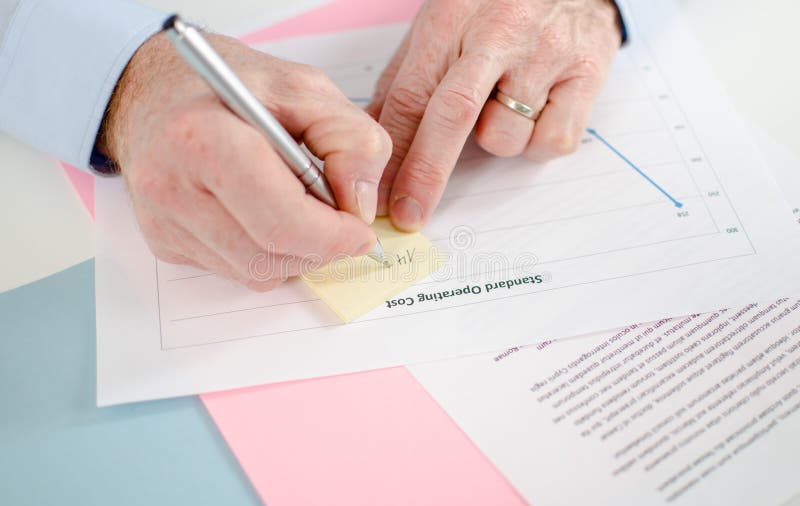 Man Taking a Note on a Post it Stock Photo - Image of message, office ...
