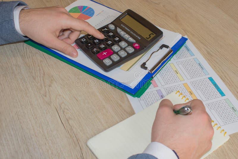 Man Taking Notes, Calculator on the Table. Success Motivation ...