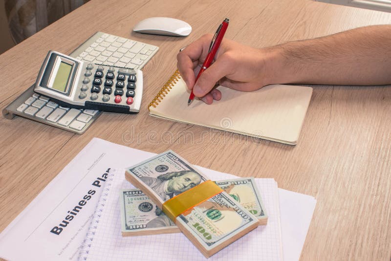 Man, Taking Notes. Man with Dollars, Cash on the Table Stock Image ...