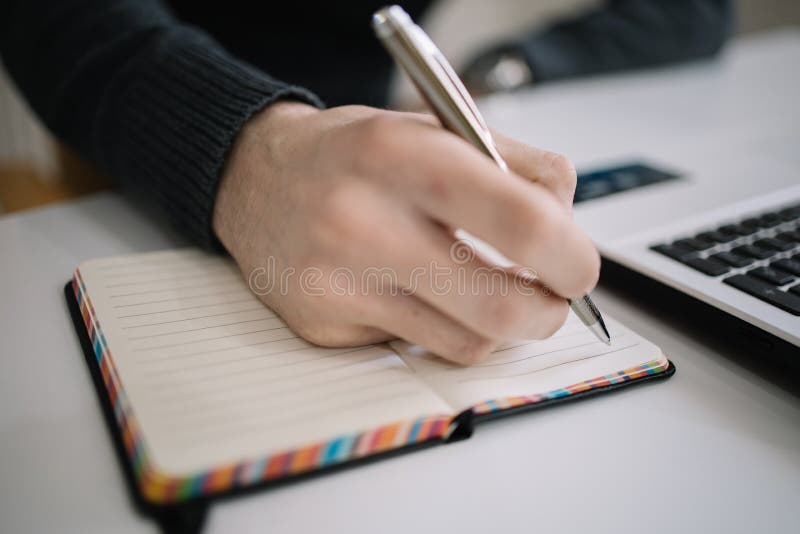 Man Taking Notes and Writing in Notepad with Pen Stock Photo - Image of ...