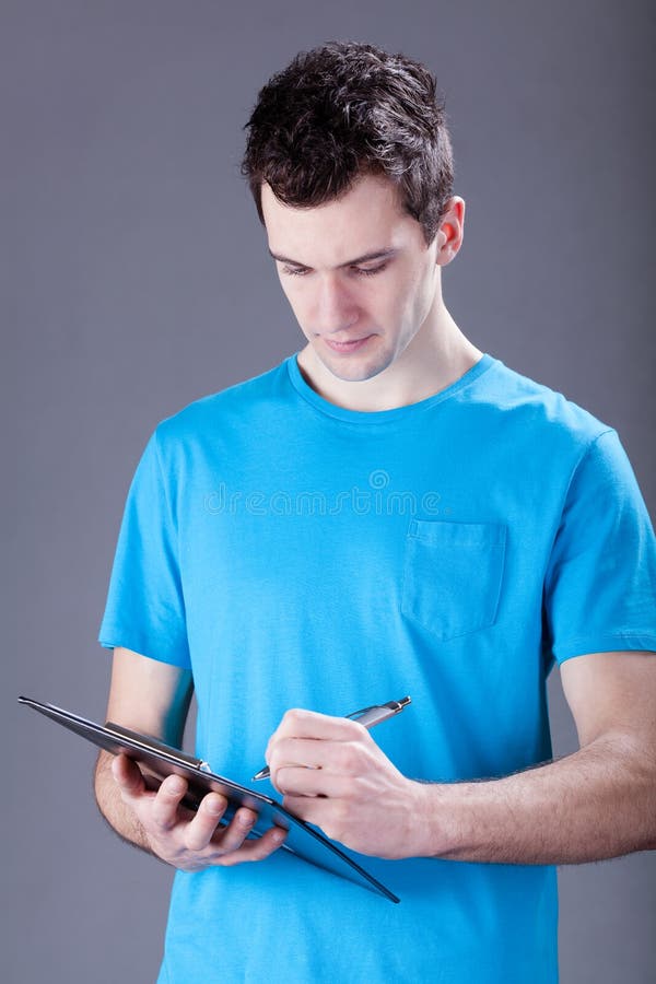Man taking notes stock image. Image of note, pencil, essay - 39178963