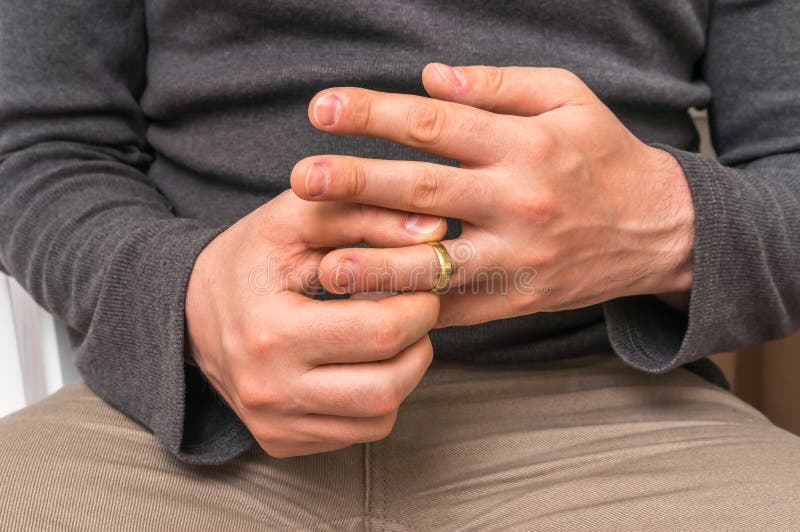 Man is Taking Off His Wedding Ring - Divorce Concept Stock Photo ...
