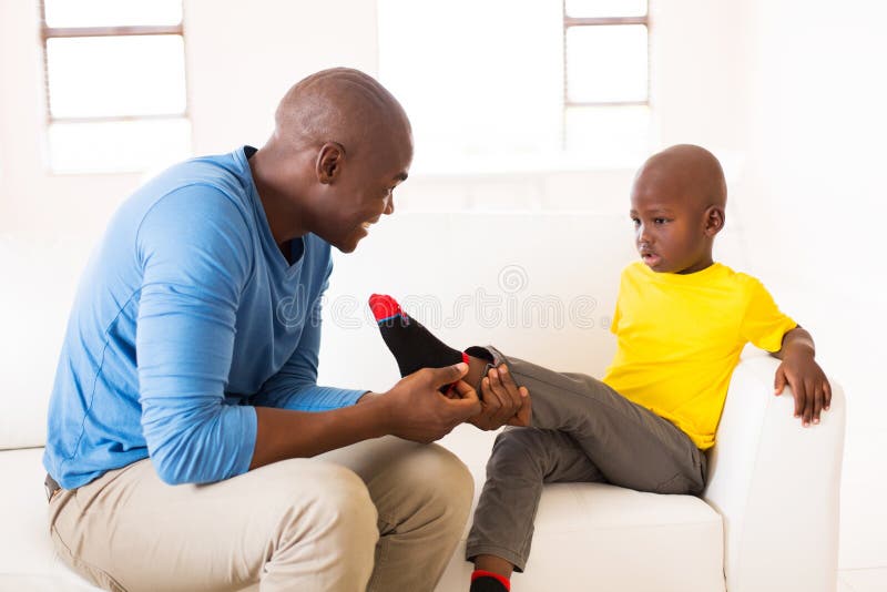 Man Taking Off Son's Socks Stock Photos - Free & Royalty-Free Stock ...