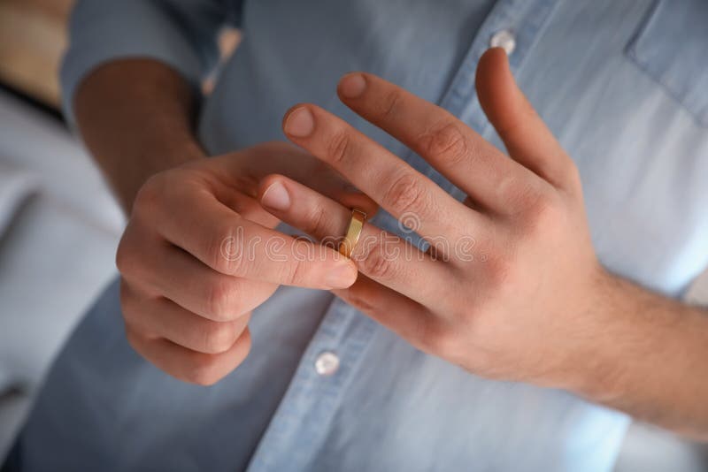 Man Taking Off Wedding Ring, Closeup. Cheating and Breakup Stock Photo ...