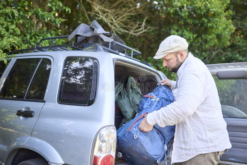 Man Taking Out Backpack Trunk His Vehicle Camping Trip Stock Photos ...