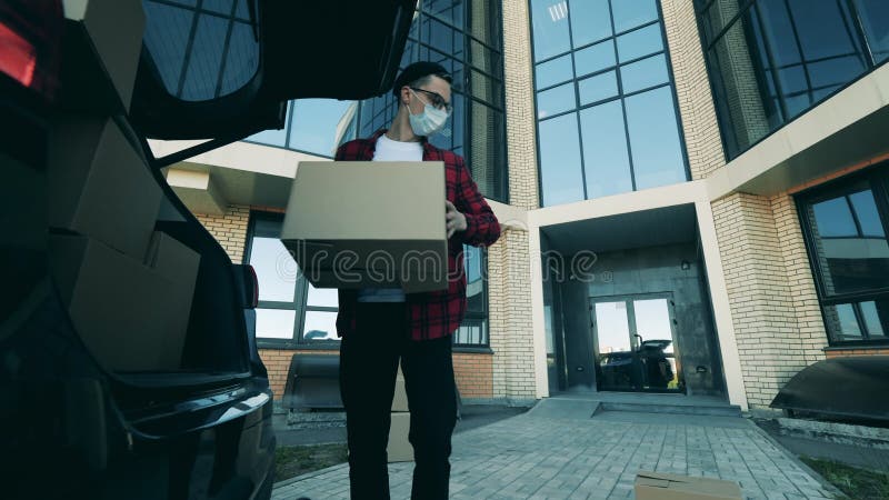 Delivery Man is Putting Carton Boxes Out of the Car Stock Video - Video ...