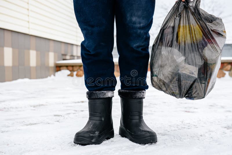 Man Taking Out the Trash Outside in Winter. Stock Photo - Image of ...