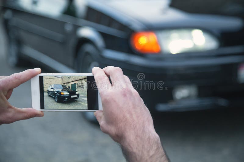 Man Taking Photo of a Car on His Phone Stock Photo - Image of driver ...
