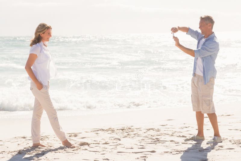 Man Taking a Photo of His Smiling Partner Stock Image - Image of ...
