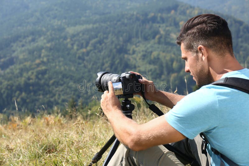 Man Taking Photo of Nature with Modern Camera on Tripod Outdoors Stock ...