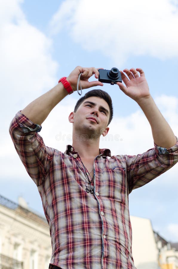 Young Man Taking Photographs Stock Photo - Image of compact, shirt ...