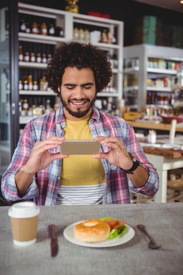 Man Taking Photograph of Breakfast Stock Photo - Image of doughnut ...