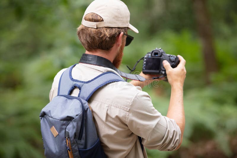 Man taking photos nature stock image. Image of idyllic - 218240037