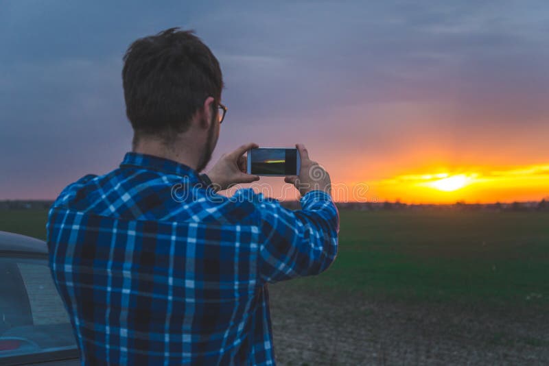 Man Taking Picture of Sunrice Stock Image - Image of transport ...
