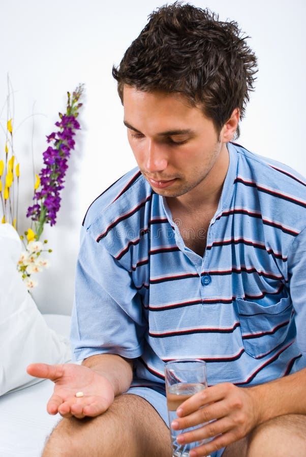 Young man taking pills stock photo. Image of ache, mouth - 14272964