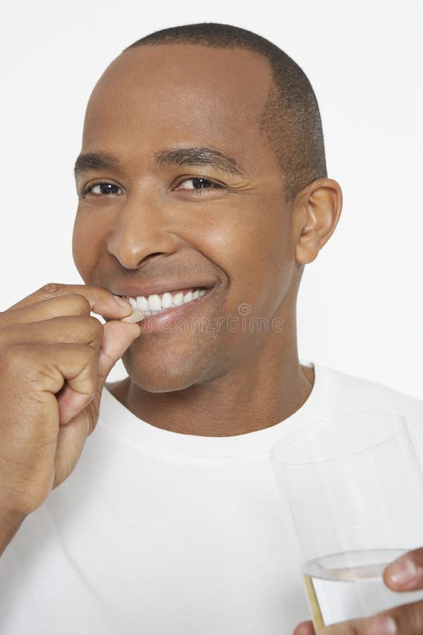 Man Taking Pill stock image. Image of treatment, happy - 29660849