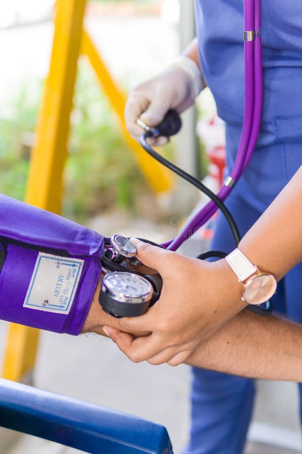 Man taking a pressure test stock image. Image of pink - 303062725