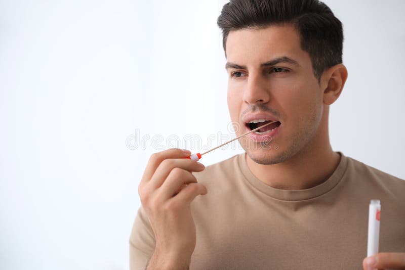 Man Taking Sample for DNA Test on Light Background Stock Image - Image ...