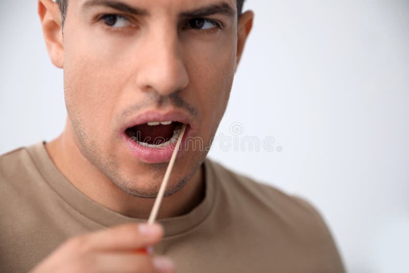 Man Taking Sample for DNA Test on Light Background, Closeup Stock Photo ...