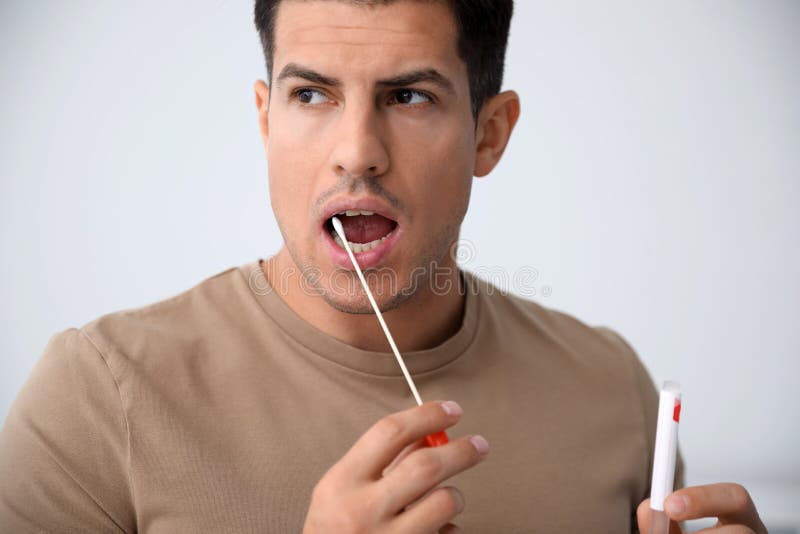Man Taking Sample for DNA Test on Light Background Stock Photo - Image ...