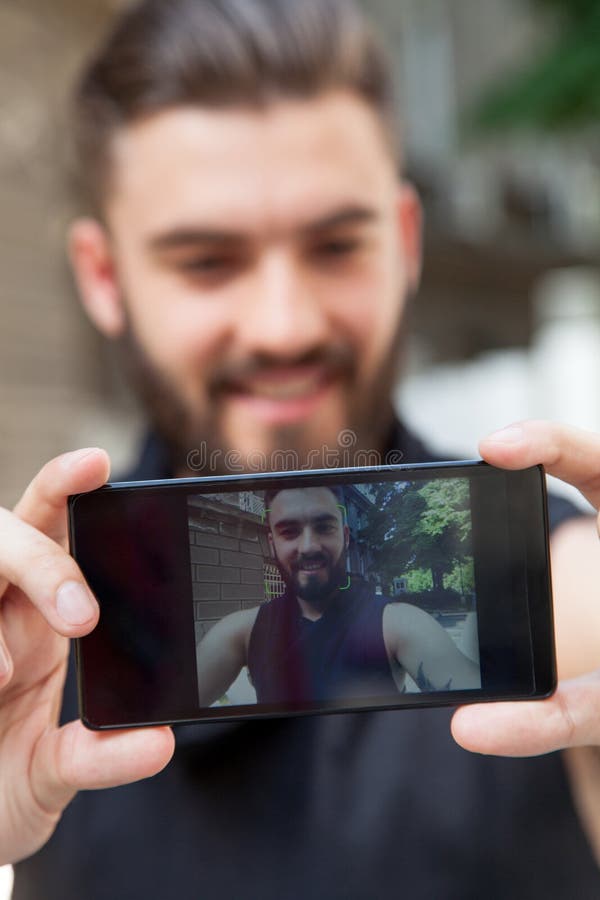 Man taking a selfie stock image. Image of standing, smart - 57654115