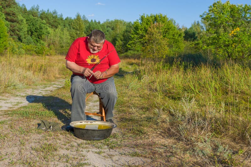 Man Taking Small Fish Off Hook Stock Photos - Free & Royalty-Free Stock ...