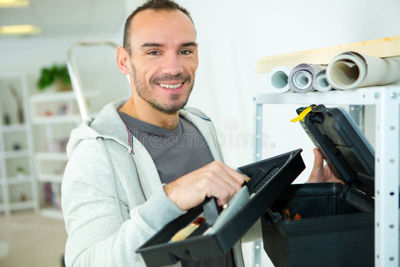 Man Taking Something Out from Toolbox Stock Image - Image of drawing ...