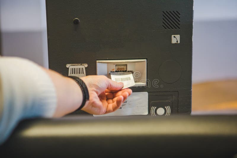 Man Taking Ticket in Front of Underground Parking Barrier Stock Photo ...