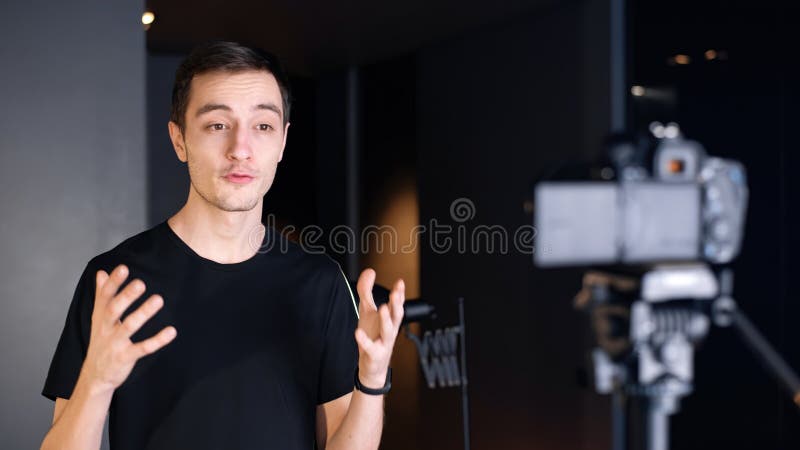 Man Talking at the Camera, Recording Himself in a Vlog. Working from ...