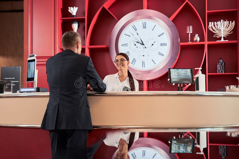 Man Talking with Female Receptionist Stock Image - Image of women ...
