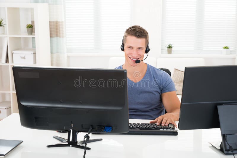Man with Headset Playing Game on Computer Stock Image - Image of device ...