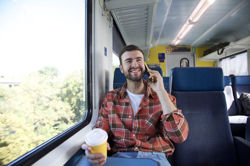 Man Talking on His Cellphone while Traveling by Train Stock Image ... Man Talking on His Cellphone while Traveling by Train Stock Image ...