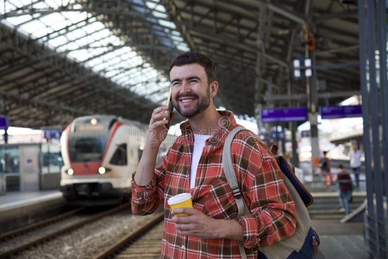 Man Talking on His Cellphone while Waiting for a Train Stock Image ... Man Talking on His Cellphone while Waiting for a Train Stock Image ...