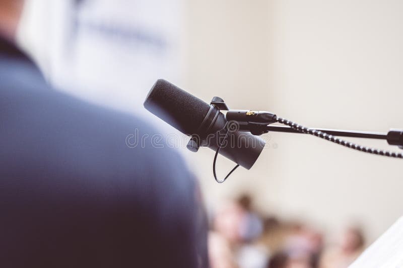 Man Talking on the Microphone on Stage - Public Speech Stock Photo ...