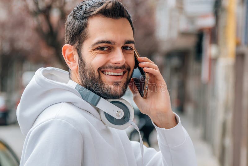 Man Talking on Mobile or Cell Phone in the Street Stock Photo - Image ...