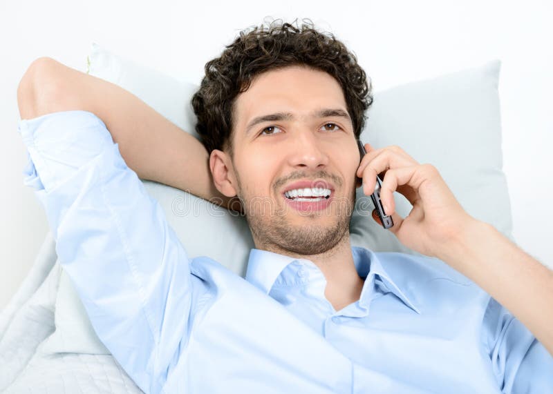 Man Talking on Mobile Phone Stock Image - Image of holding, indoor ...