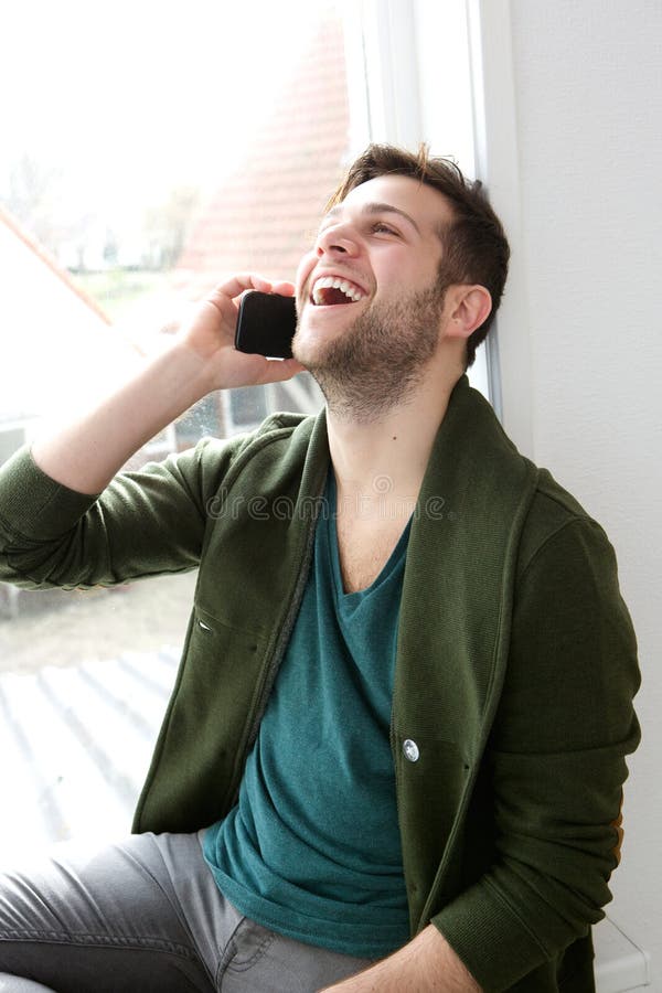 Man Talking on Mobile Phone at Home Stock Photo - Image of happy ...