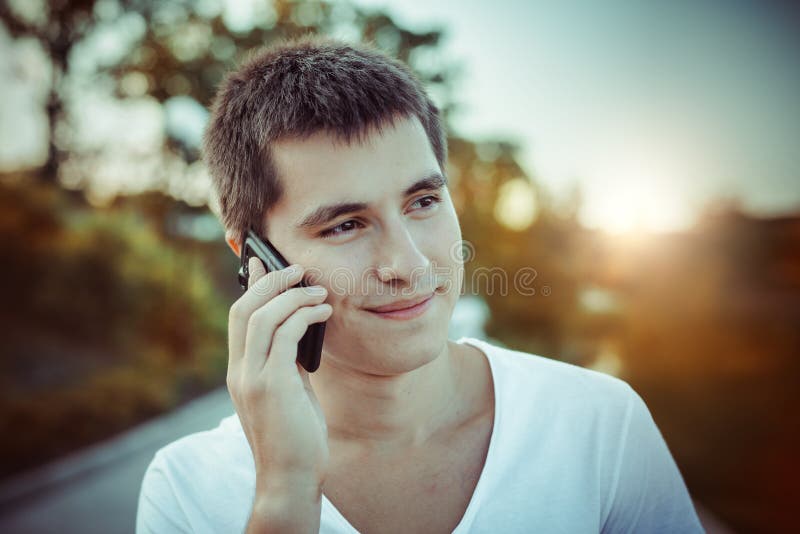 Man Talking by the Mobile Phone Outdoors Stock Photo - Image of people ...