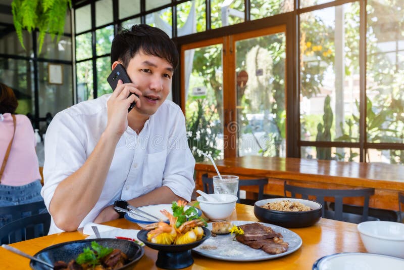 Man Talking on Mobile Phone in Restaurant Stock Photo - Image of mobile ...