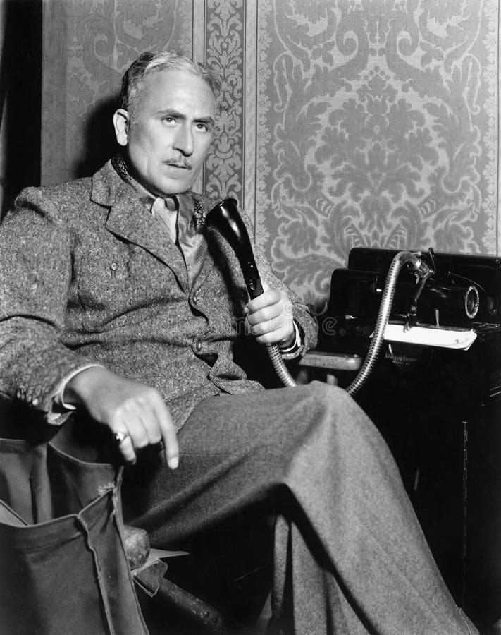 Man Talking on an Old Fashioned Telephone Stock Photo - Image of ...