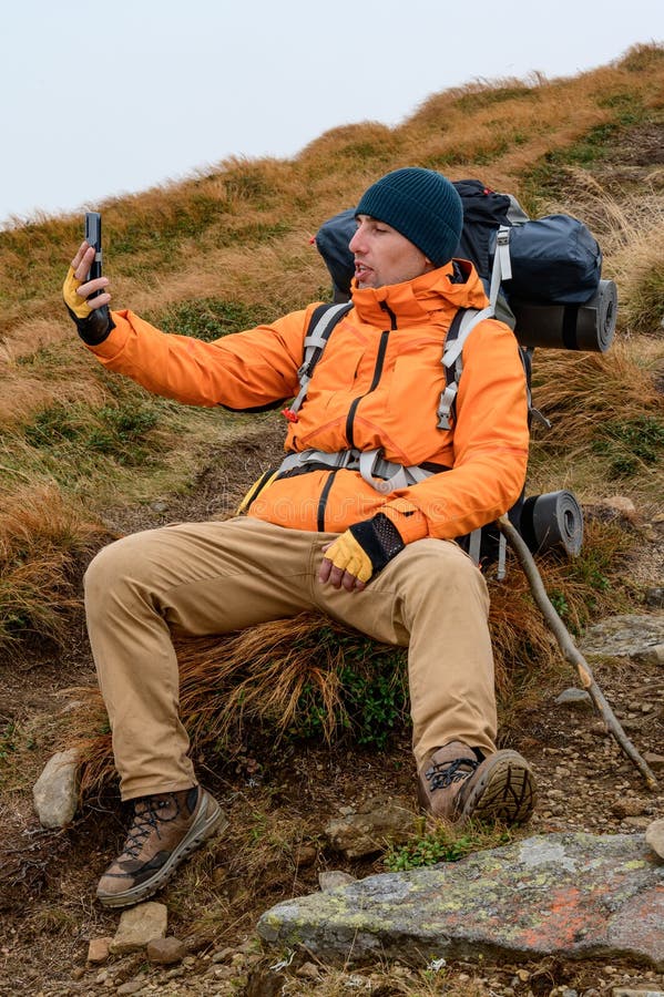A Man Talking on the Phone in the Mountains, Mobile Network and ...