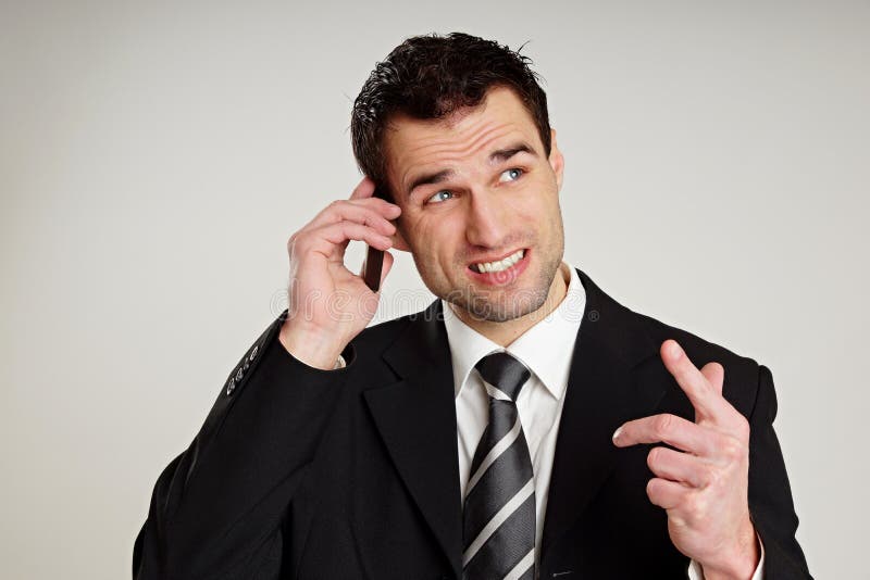 Man Talks into Mobile Phone Stock Photo - Image of emotion, cheerful ...