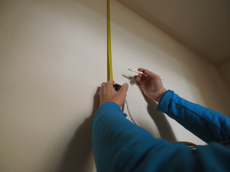A Man with a Tape Measure and a Pen Stock Photo - Image of measuring ...