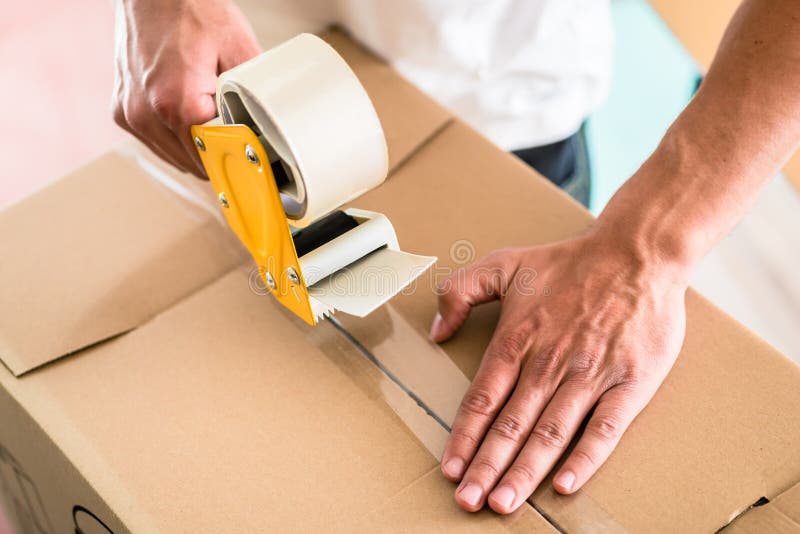 Taping a box up stock photo. Image of hardwood, seal, storage - 664486