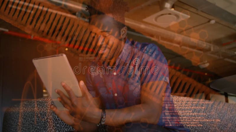 Man Tapping Tablet Screen in Modern Tech Office Lounge, Showcasing ...