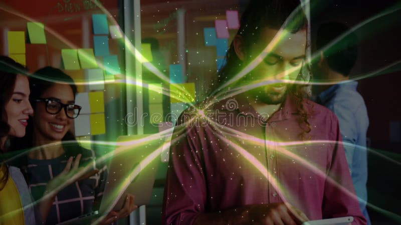 Man Tapping Tablet in Tech Office Sending Glowing Data Burst Animating ...