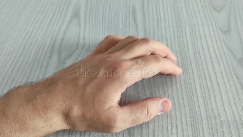 Man Taps the Fingers of His Left Hand on the Table. Waiting or Nervous ...