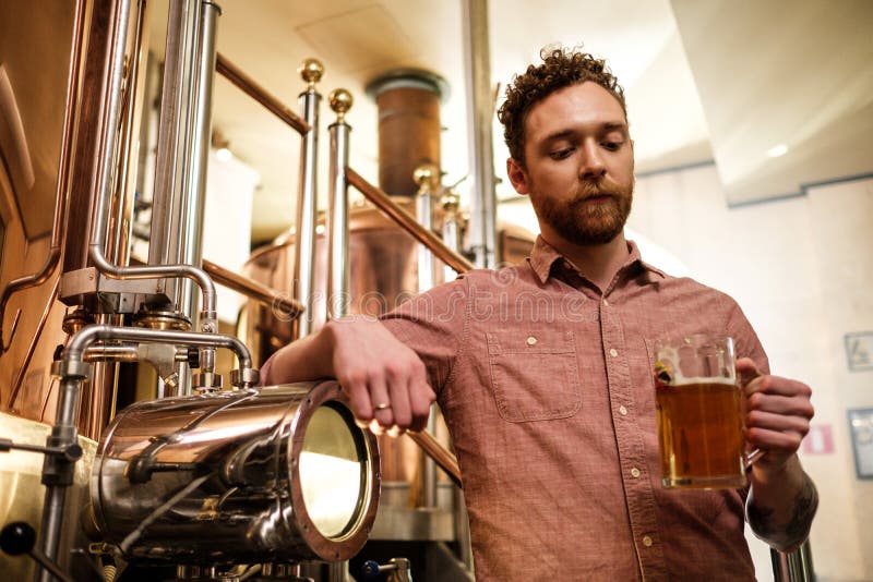 Man Tasting Fresh Beer in a Brewery Stock Photo - Image of ...